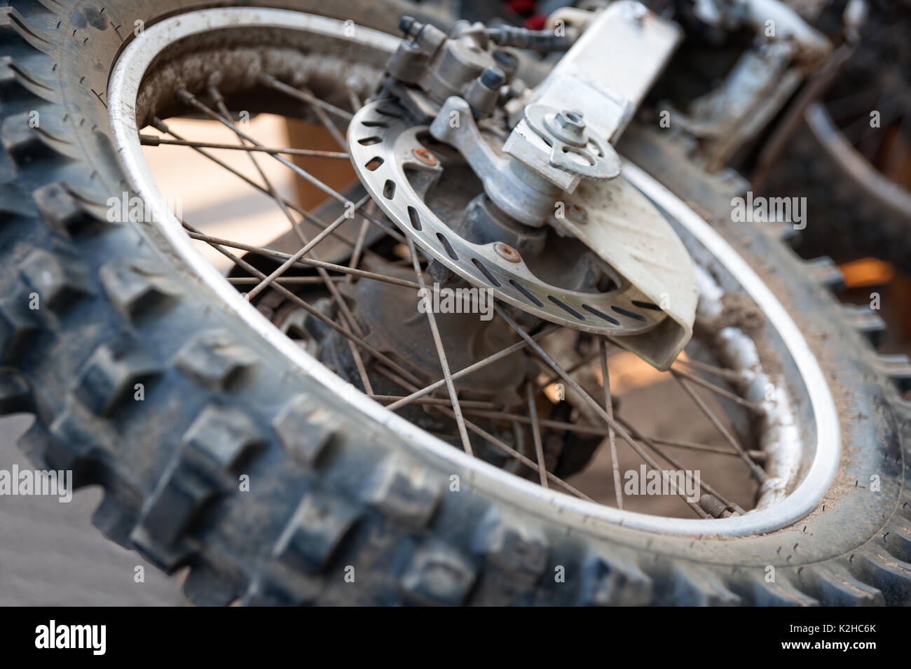 Closeup view of a rear wheel and drive wheel hub of a dirty, grunge ...