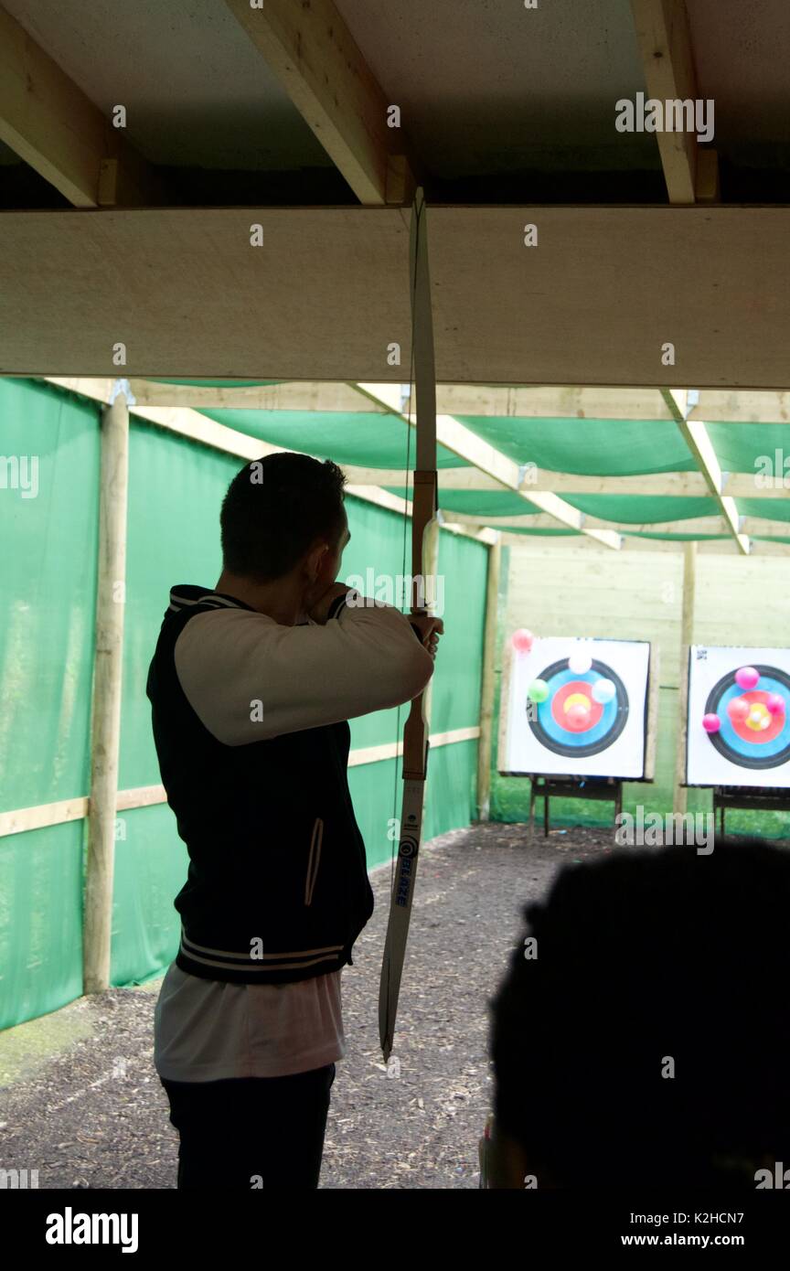 Man practising archery Stock Photo - Alamy