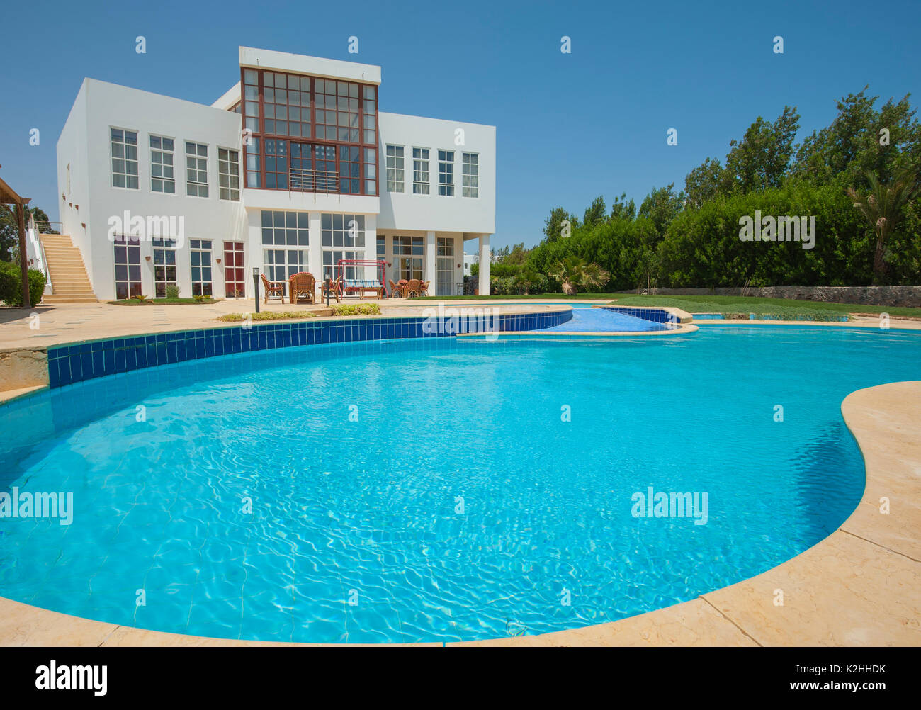 Luxury villa show home in tropical summer holiday resort with swimming ...