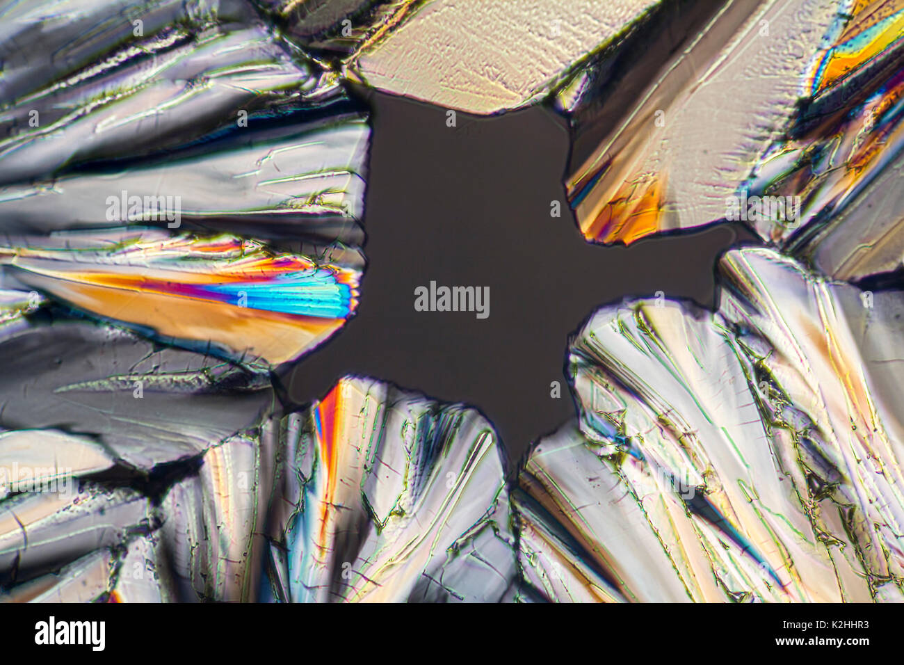 colorful microscopic shot of sugar micro crystals in polarized light ...