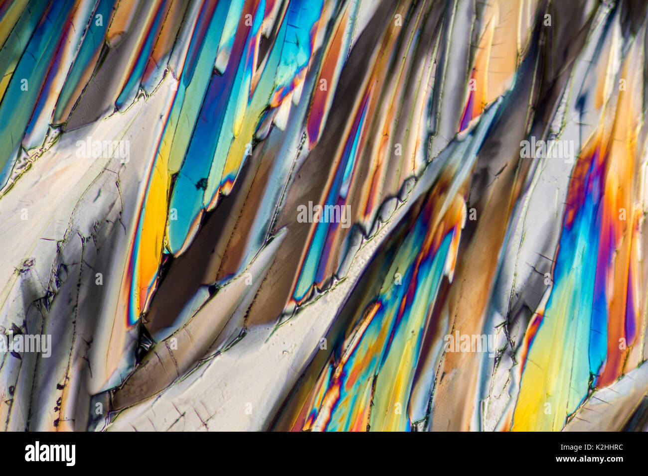 colorful microscopic shot of sugar micro crystals in polarized light ...