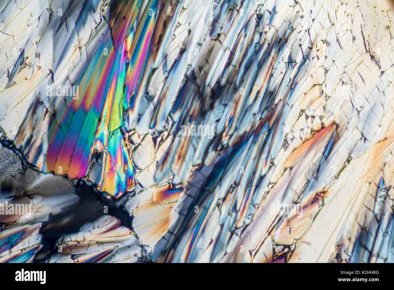 colorful microscopic shot of sugar micro crystals in polarized light ...