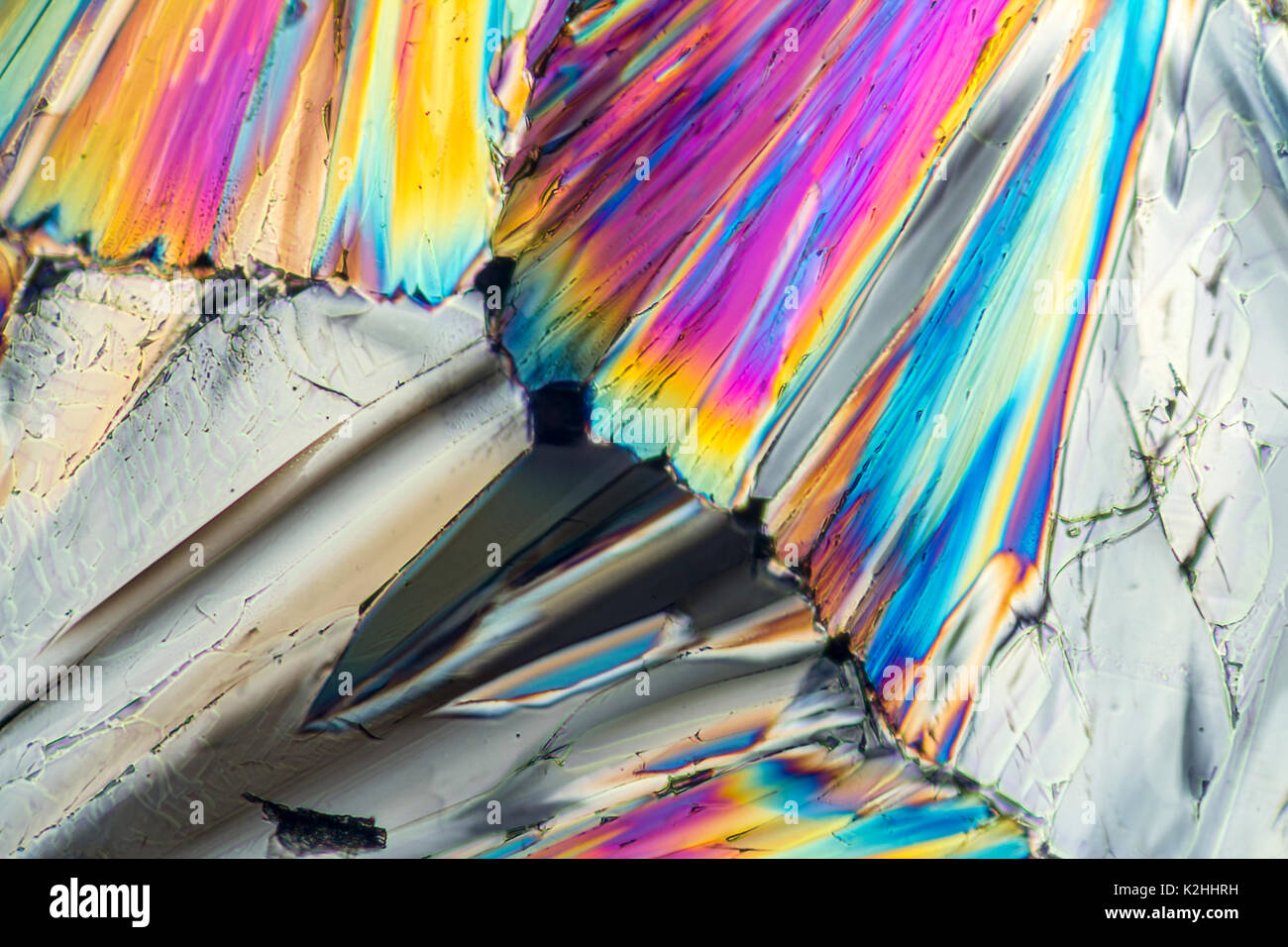 colorful microscopic shot of sugar micro crystals in polarized light ...
