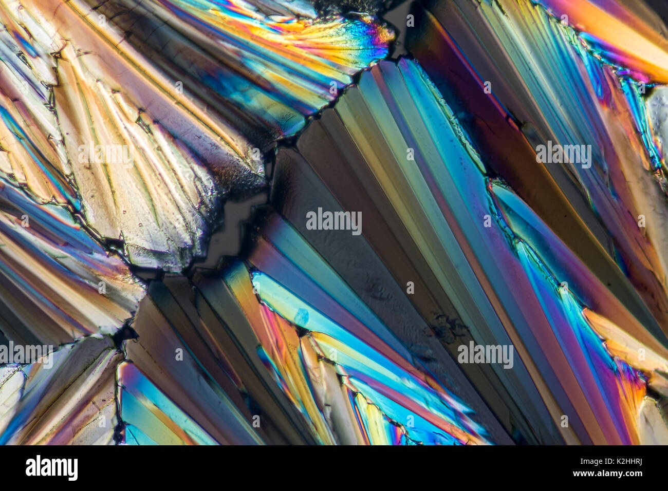 colorful microscopic shot of sugar micro crystals in polarized light ...