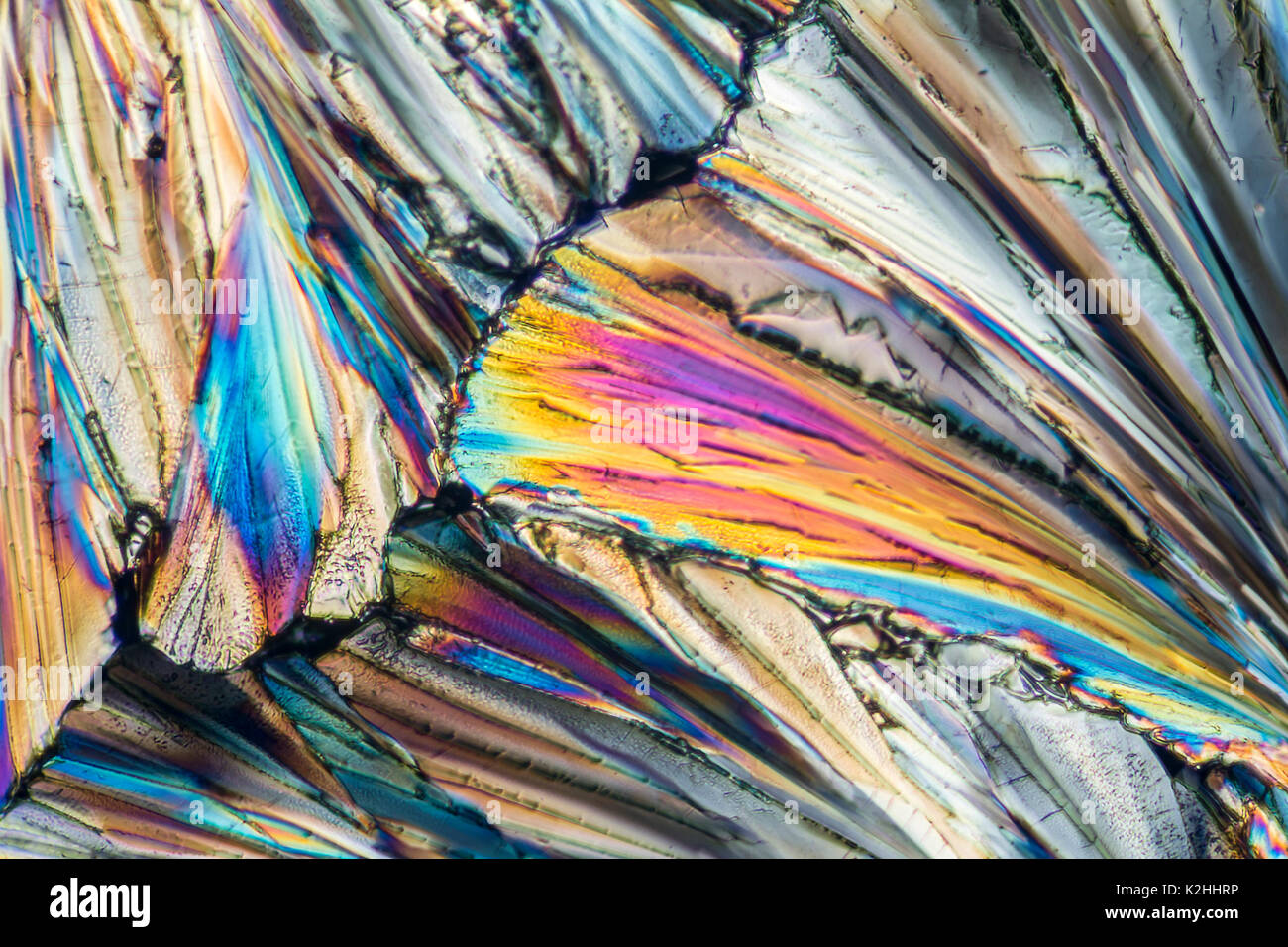 colorful microscopic shot of sugar micro crystals in polarized light ...