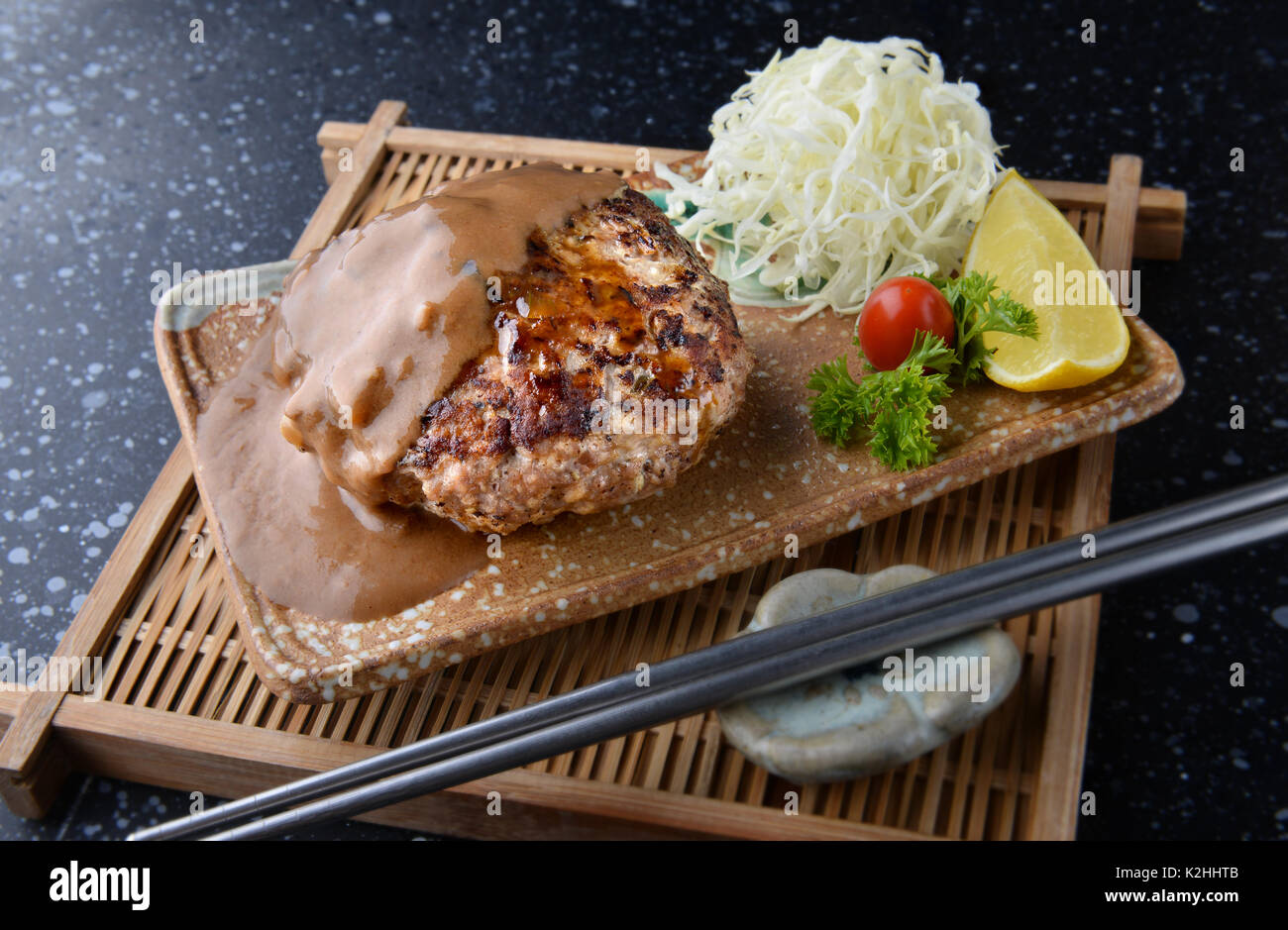 Hamburger steak in Japanese style or hambagu serve with fresh vegetable ...