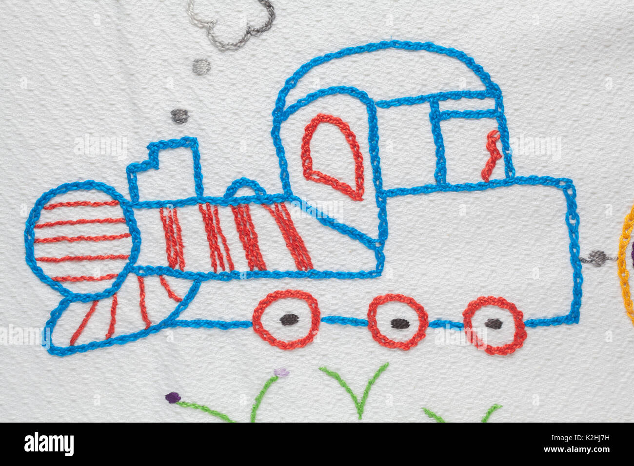 Embroidery with baby's motifs. Train Stock Photo - Alamy