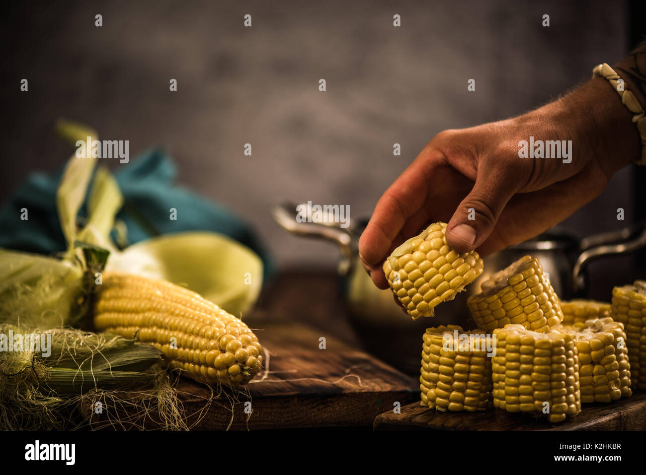 Cooking whole corn on the hob, autumn healthy snack Stock Photo - Alamy