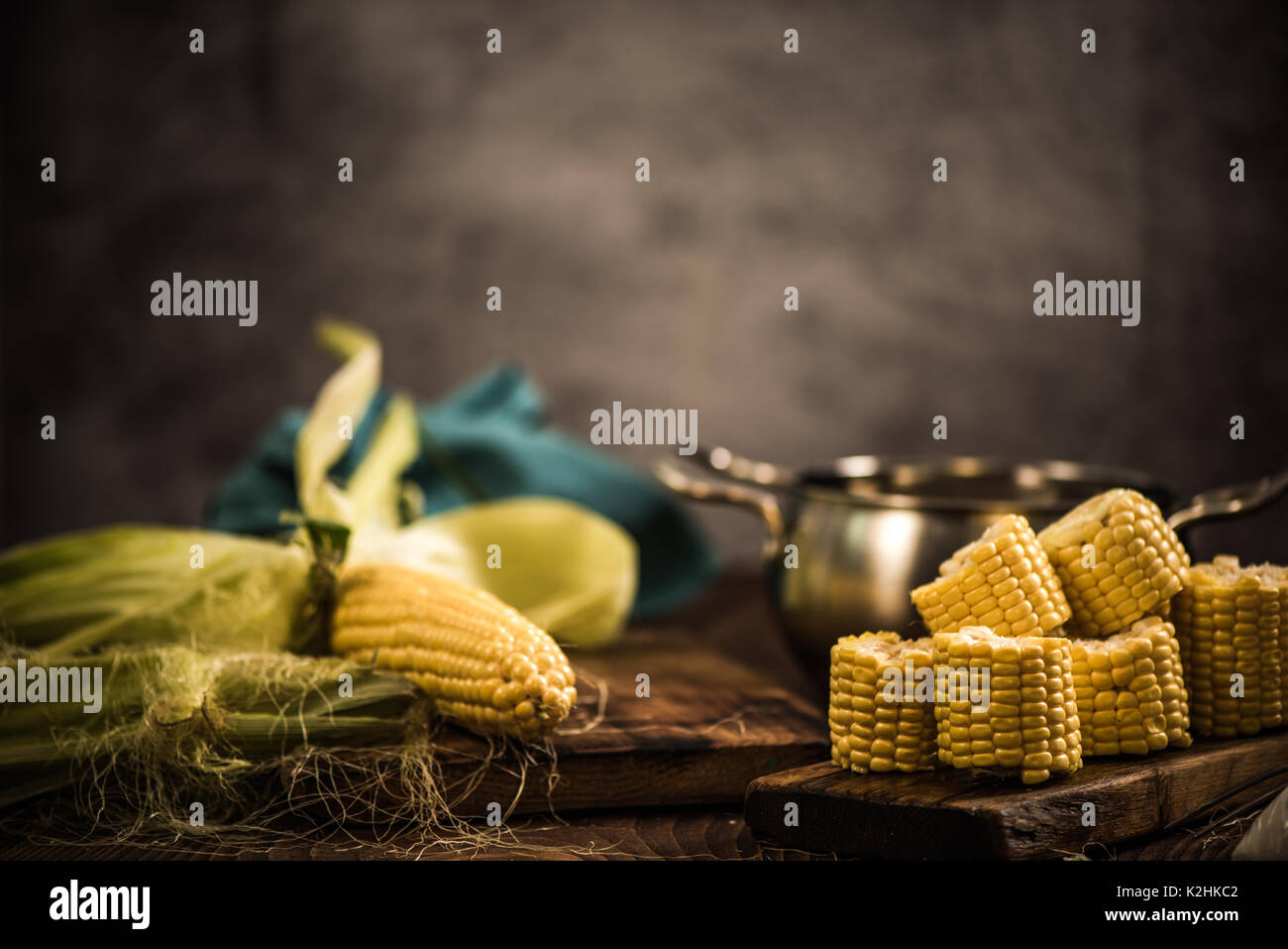 Cooking whole corn on the hob, autumn healthy snack Stock Photo - Alamy
