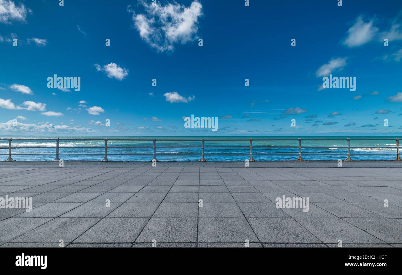 Empty Promenade and Blue Ocean Background Stock Photo - Alamy