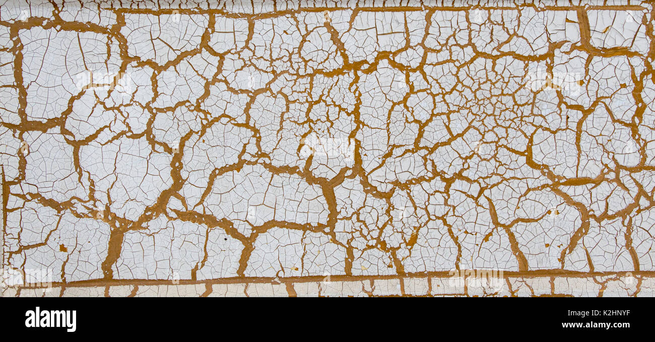 Cracked paint design on a wall surface. Close Up Stock Photo - Alamy