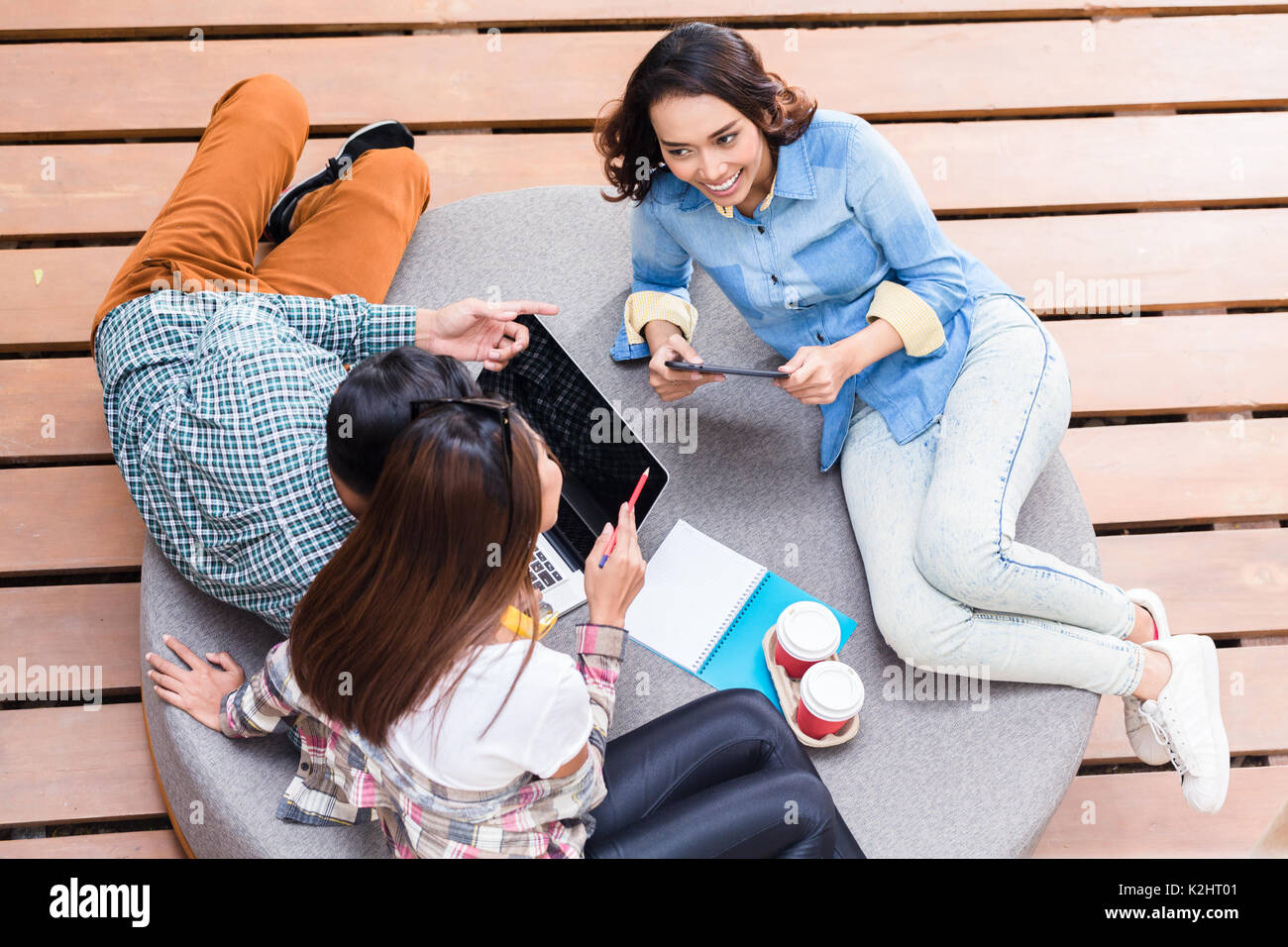 Three creative employees sharing ideas during brainstorming sess Stock ...