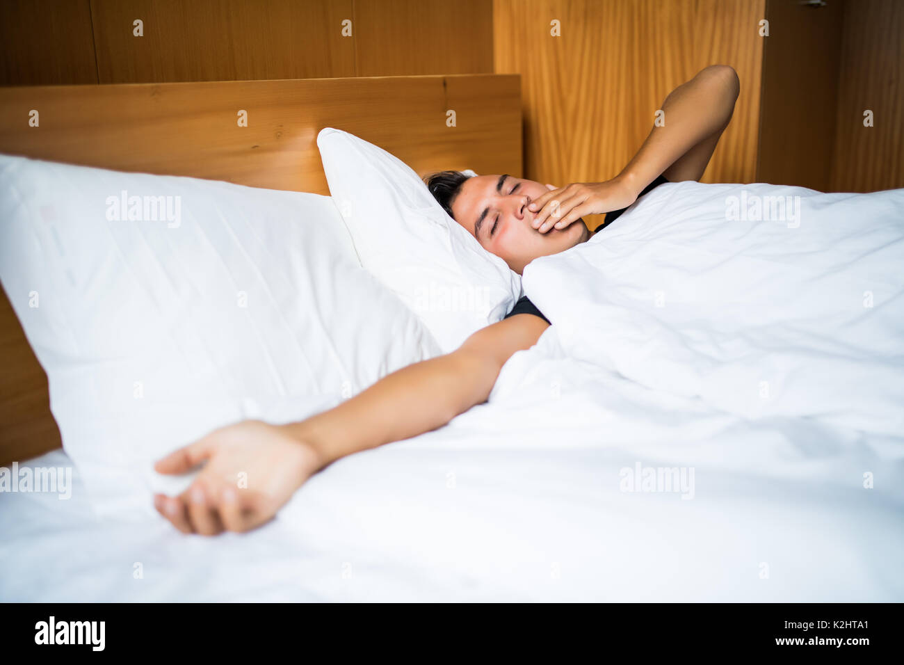 Muscular man sleeping in bed hi-res stock photography and images - Alamy