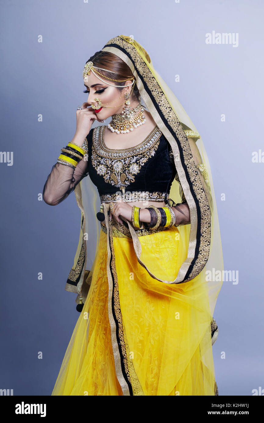 Portrait of beautiful indian girl . Young hindu woman model on blue ...