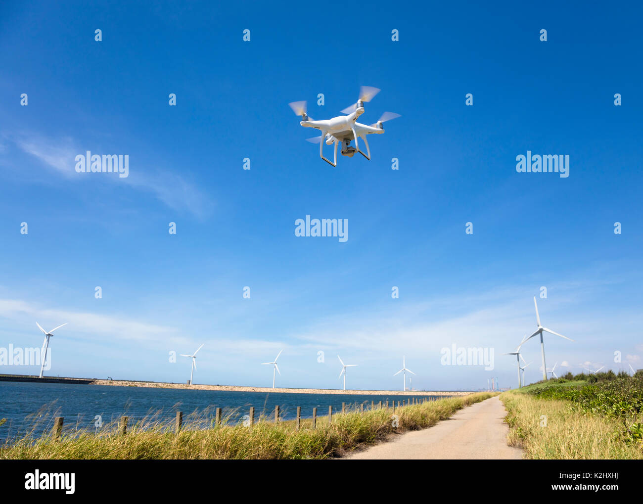 drone flying over the blue sky with wind turbine Stock Photo - Alamy