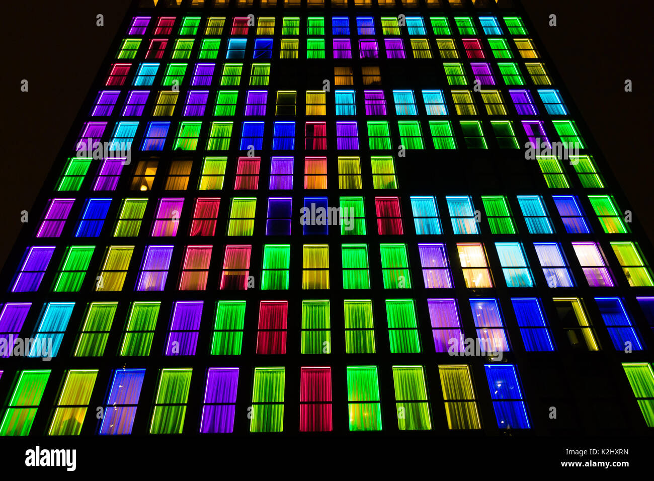 Colored windows texture. Windows illuminated by neon lights background ...