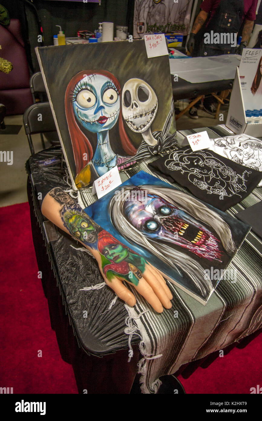 Grotesque paintings, a tattoo sample on an artificial arm and silver ...