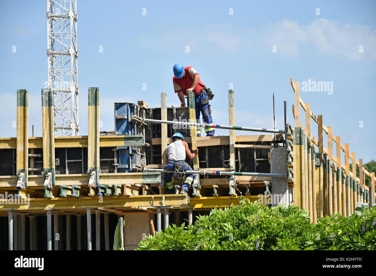 Construction workers at work Stock Photo - Alamy