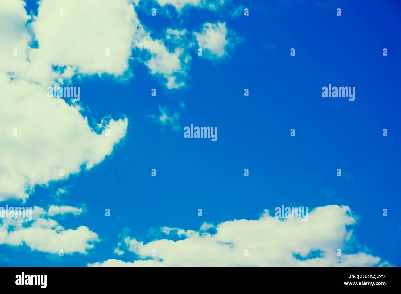 Sky and clouds. Retro style filtered image. Bright blue sky with white ...