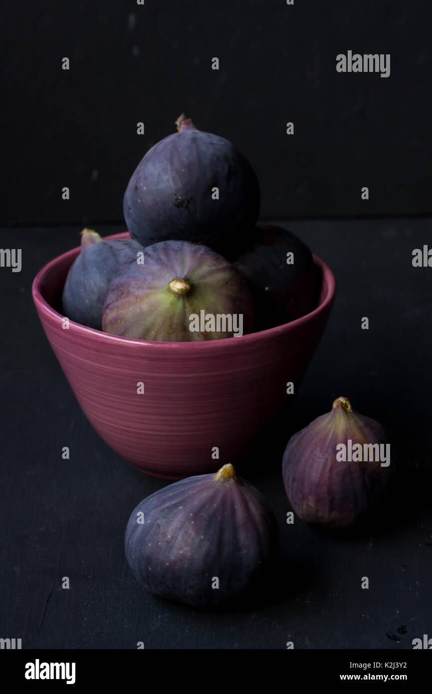 figs on a black background Stock Photo - Alamy