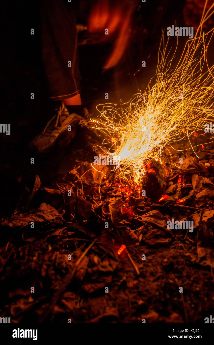 Closeup male hand and bonfire slow shutter picture Stock Photo - Alamy