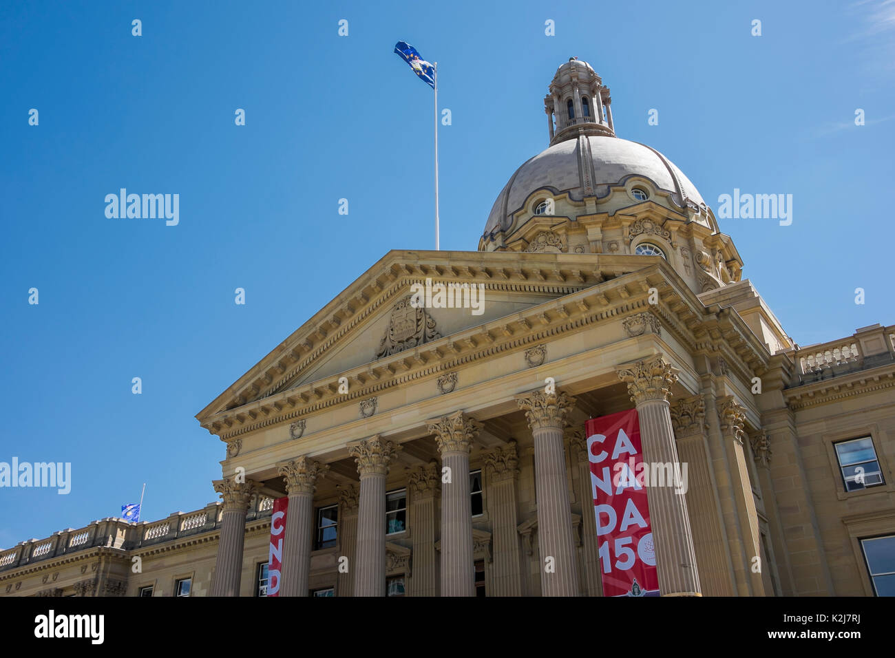 Alberta Legislature Building with columns and Canada 150 Banner ...