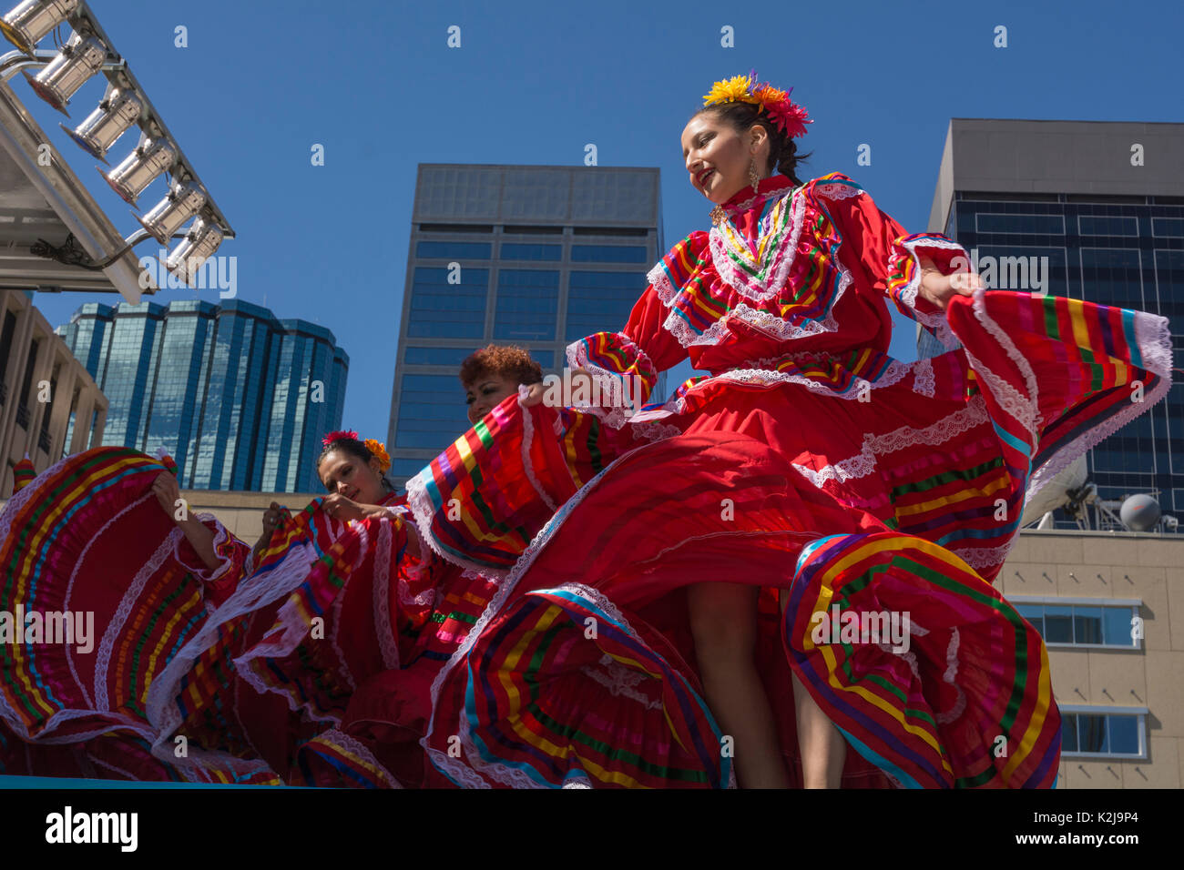 Dancers wearing colorful dresses at Latin Festival, Edmonton, Alberta ...