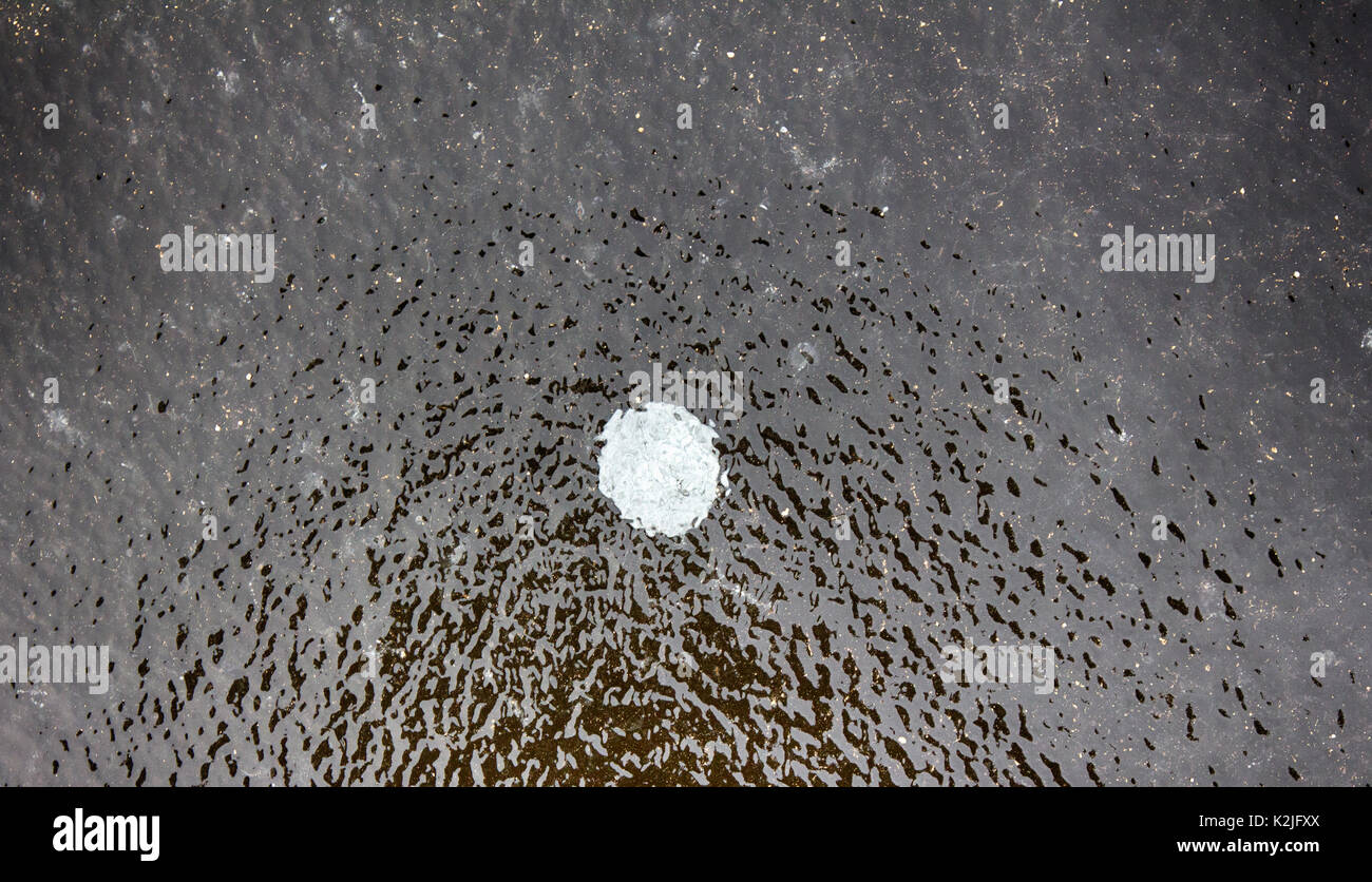 background ice beautiful after a heavy frost. frozen in ice cavity with ...