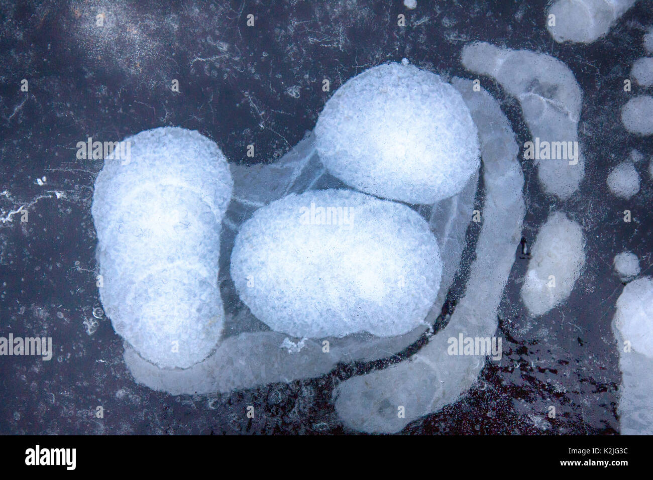 background ice beautiful after a heavy frost. frozen in ice cavity with ...