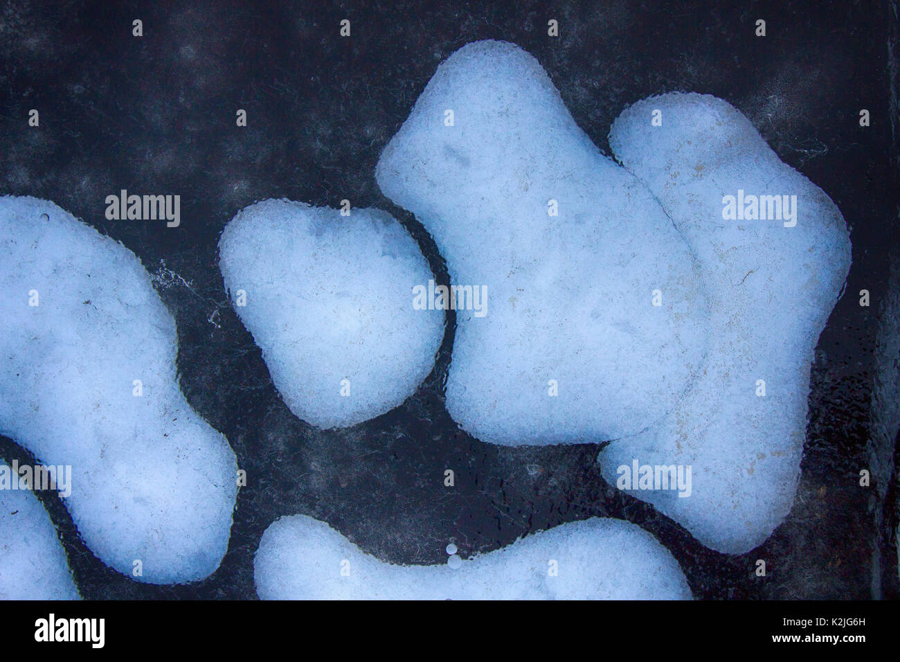 background ice beautiful after a heavy frost. frozen in ice cavity with ...