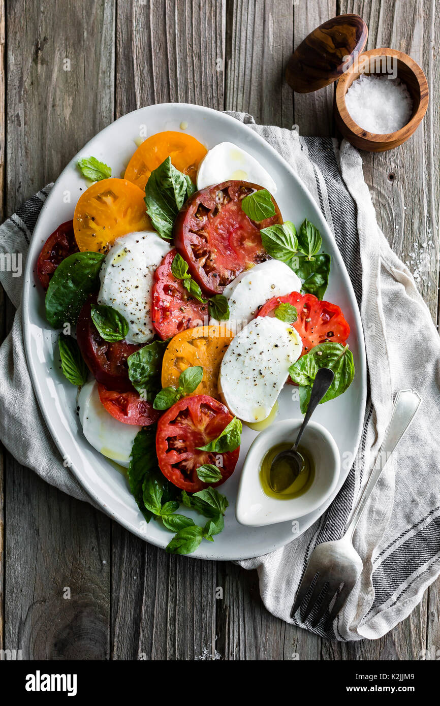 Caprese Salad on a rustic wooden background Stock Photo - Alamy