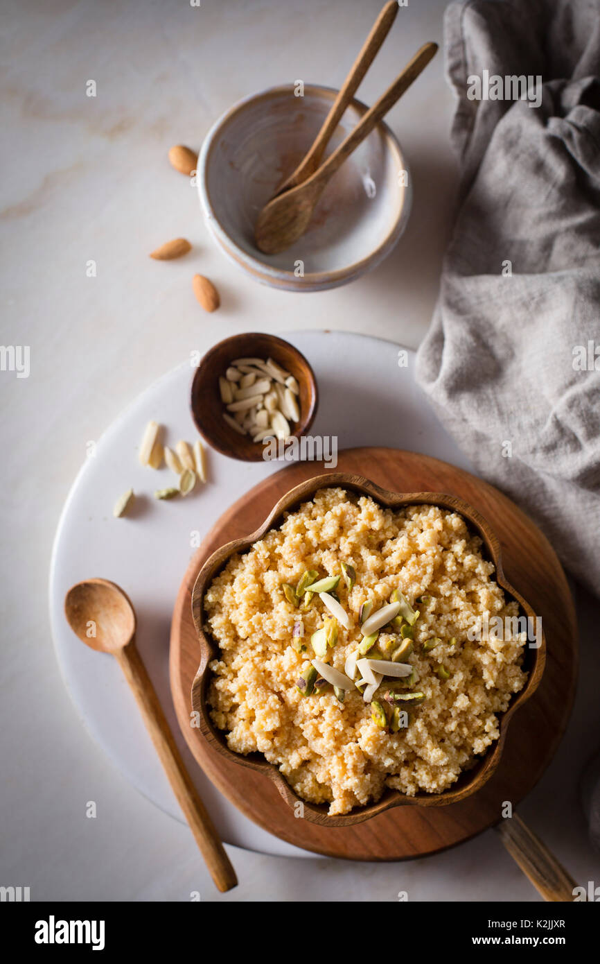Thirattupaal / Paalgova in a wooden bowl on top view Stock Photo - Alamy