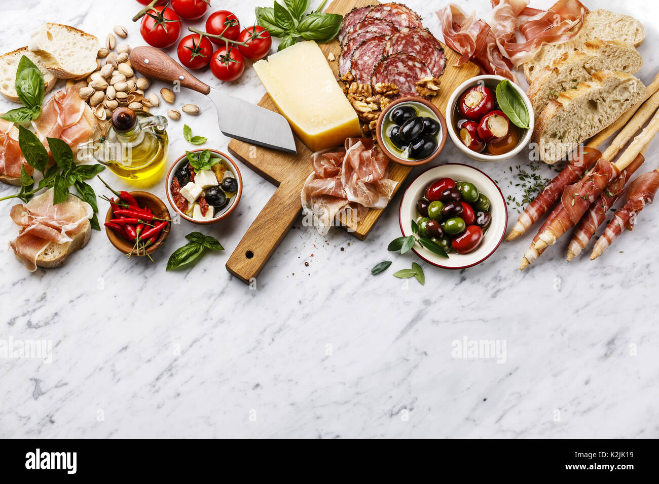 Italian snacks food with Ham, Sliced bread Ciabatta, Olives, Parmesan ...