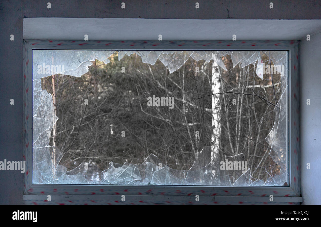 glass breakage, danger. big window with blue glass destruction Stock ...