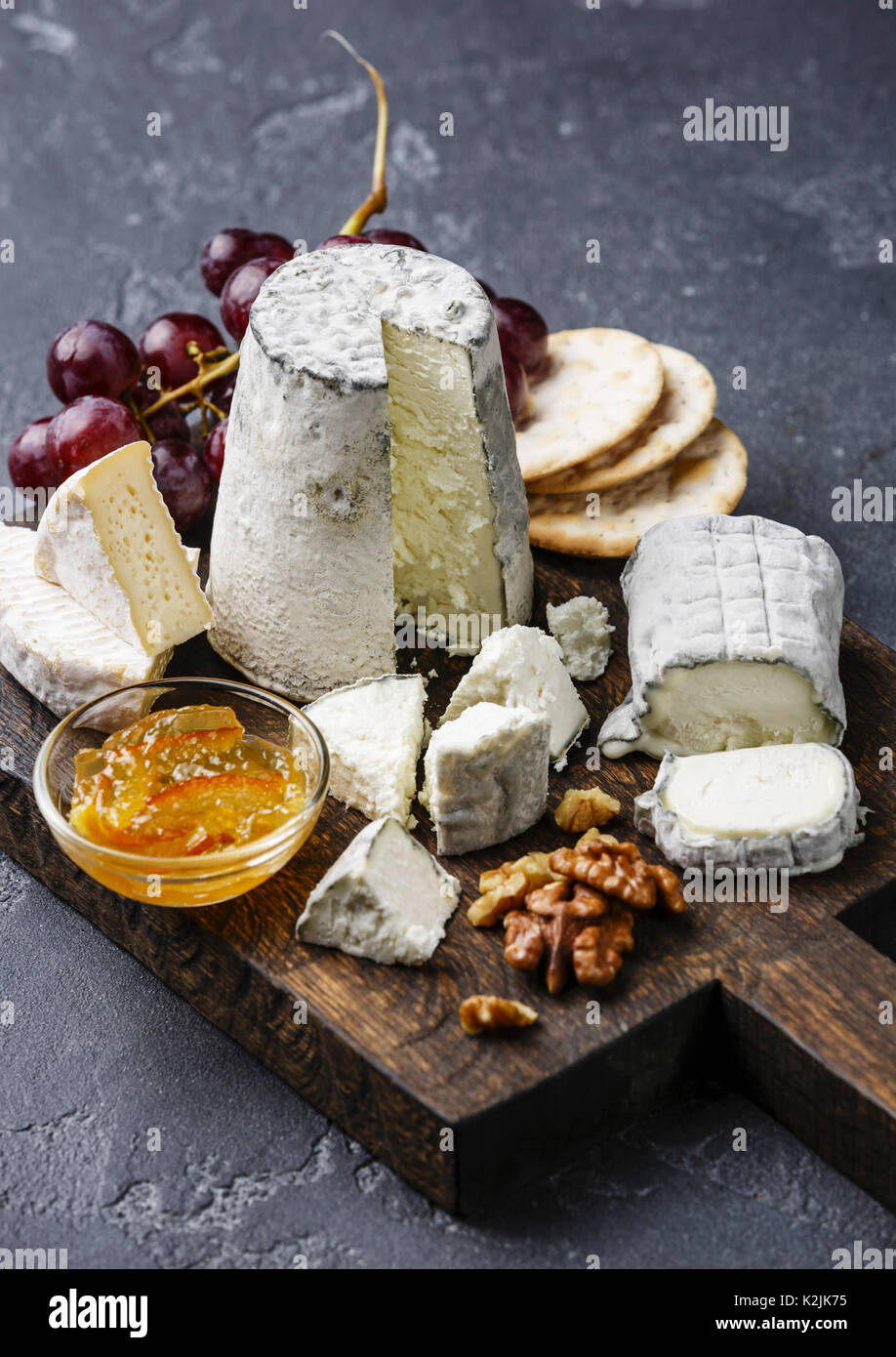 Goat Cheese board Snack assortment with confiture and grape on cutting ...