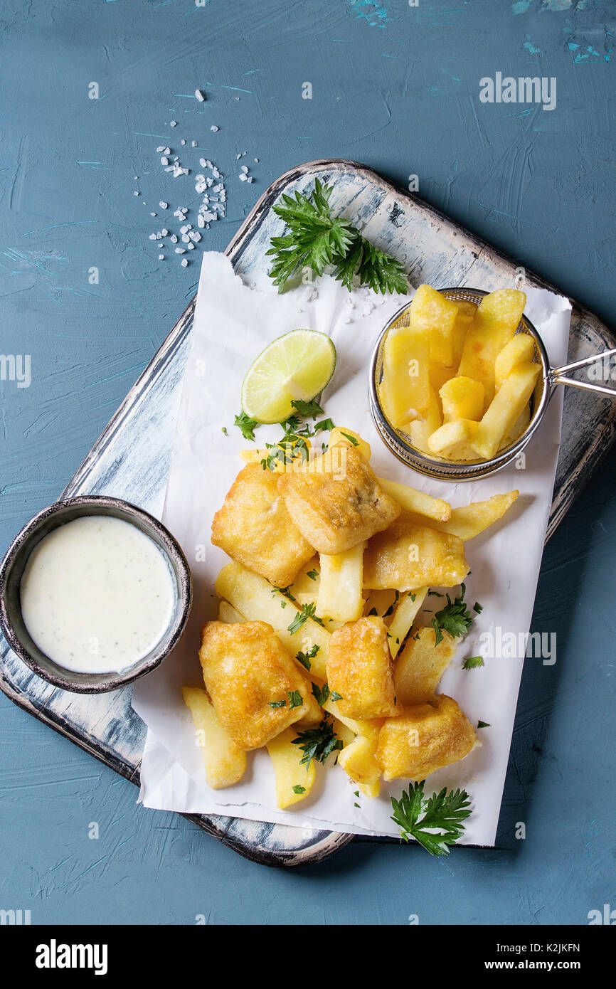 Traditional british fast food fish and chips. Served with white cheese ...