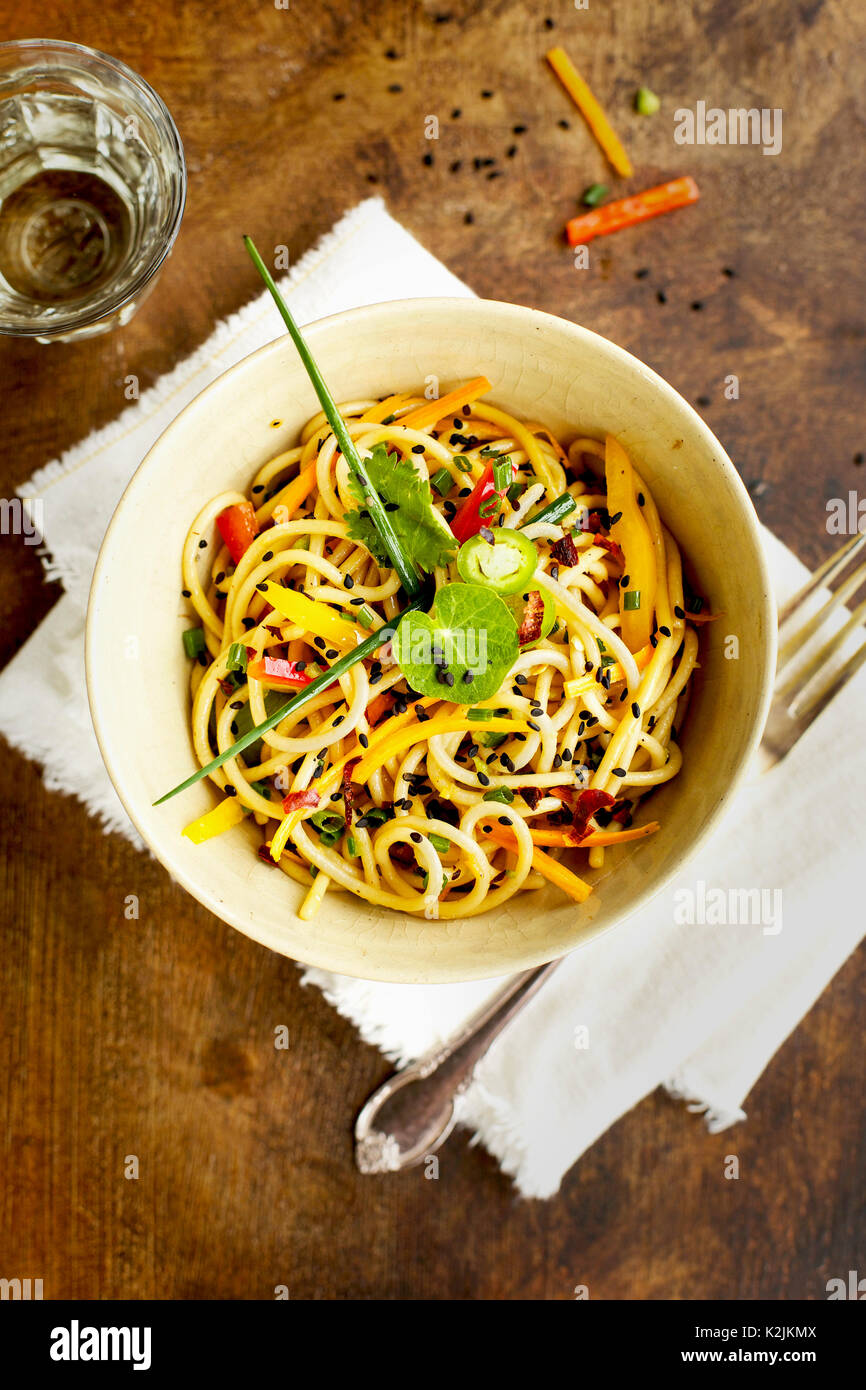 Asian Sesame Pasta Salad served with white wine. Photographed on a ...