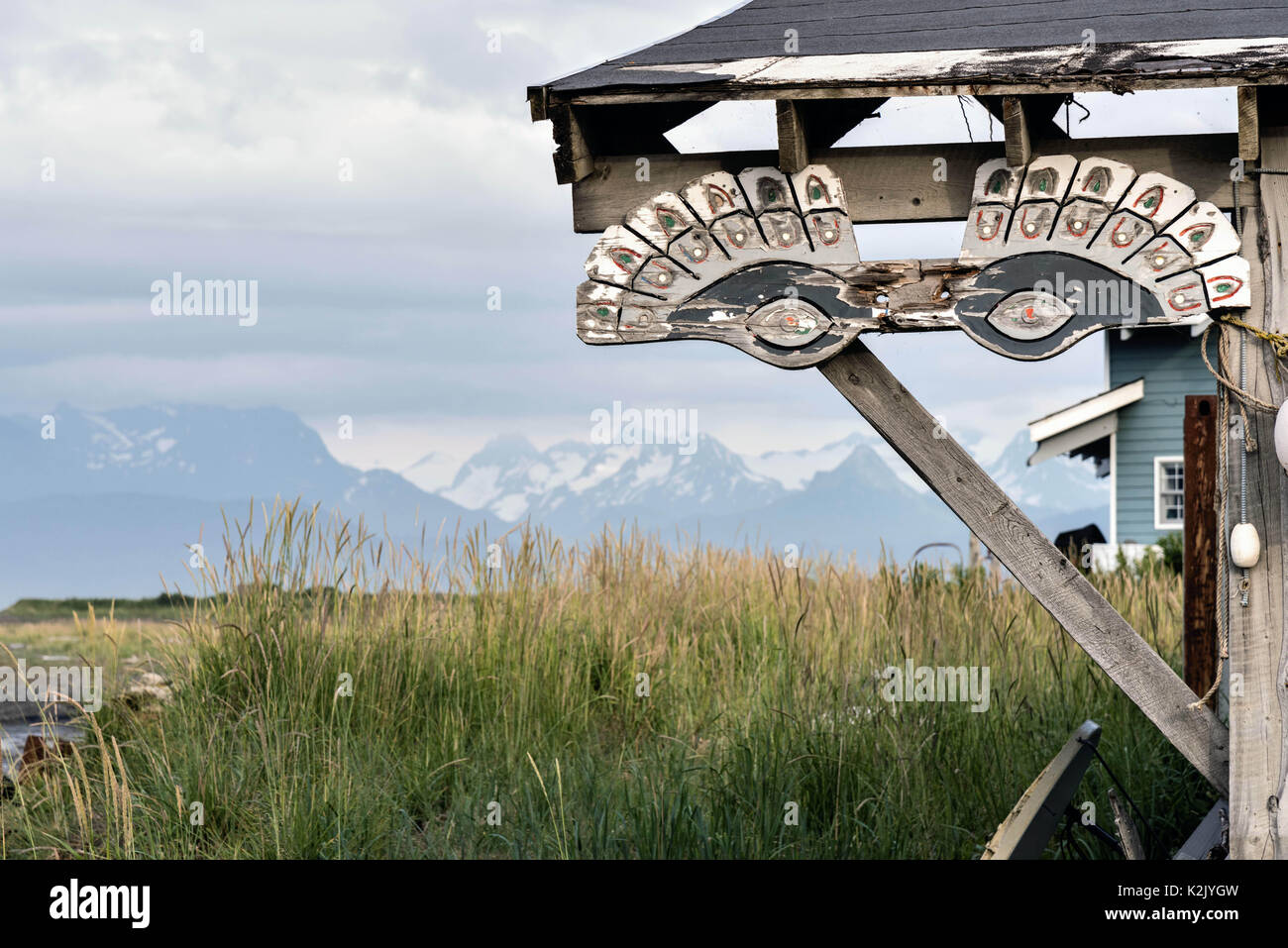 A Native Alaskan wood carving on an old house along the Homer Spit on ...