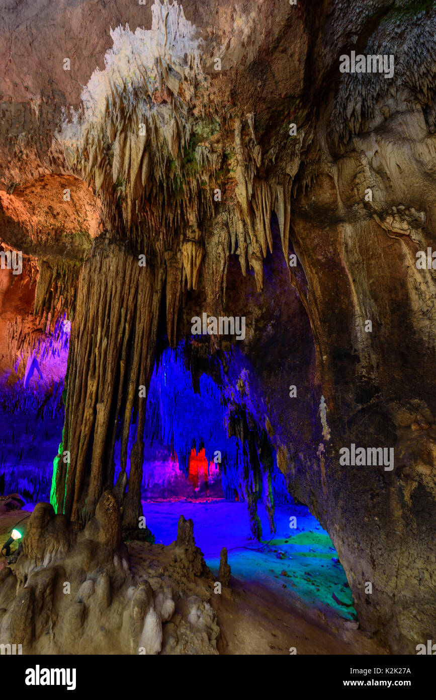 Stalactite stalactites with color lighting in cave Stock Photo - Alamy