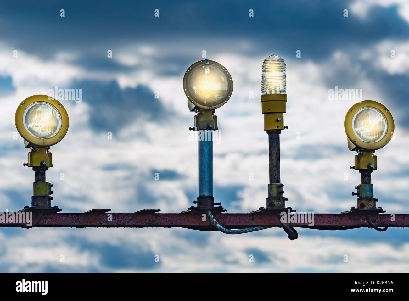 Lights of the glide path on evening sky background Stock Photo - Alamy