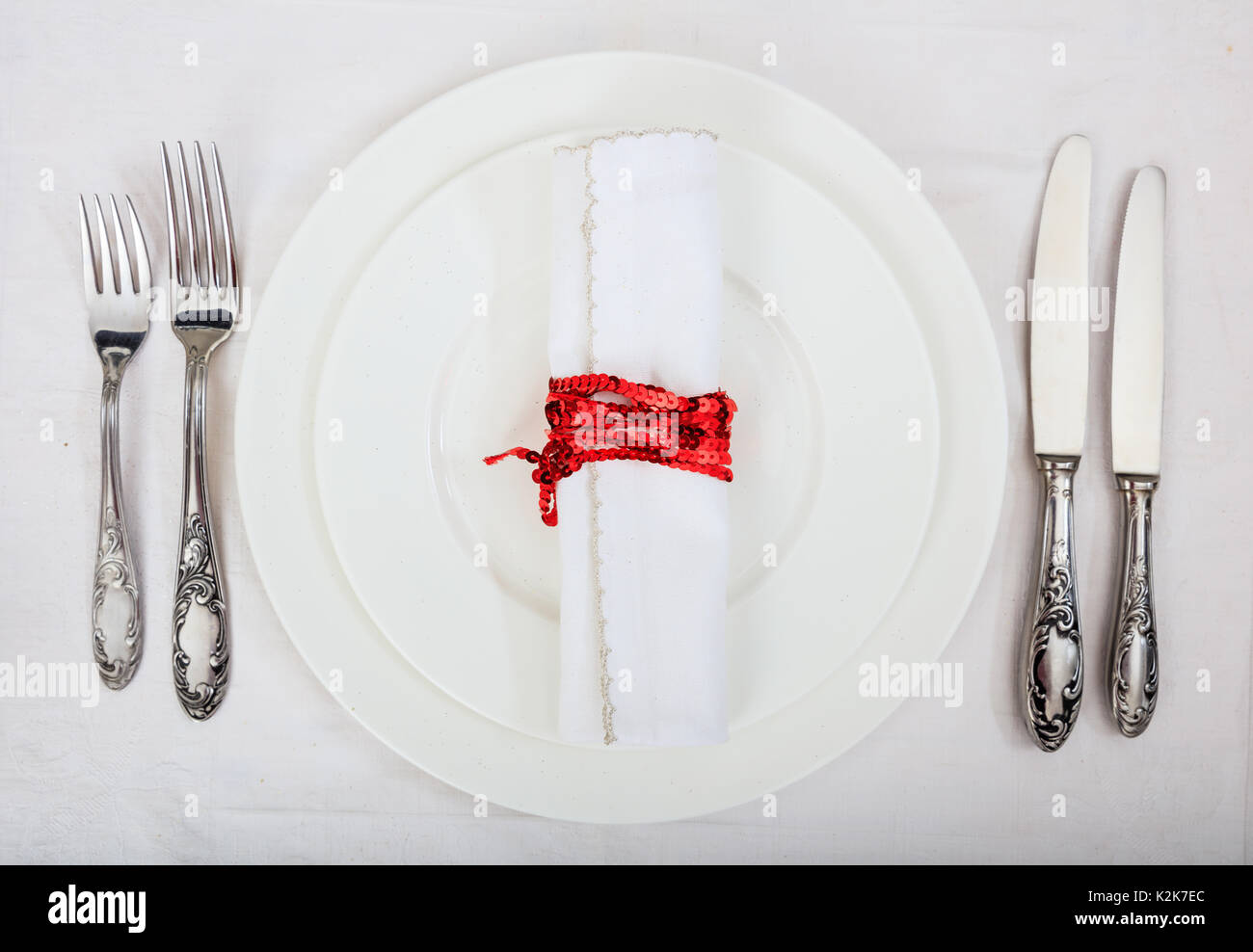 Formal, festive place setting on white background Stock Photo - Alamy