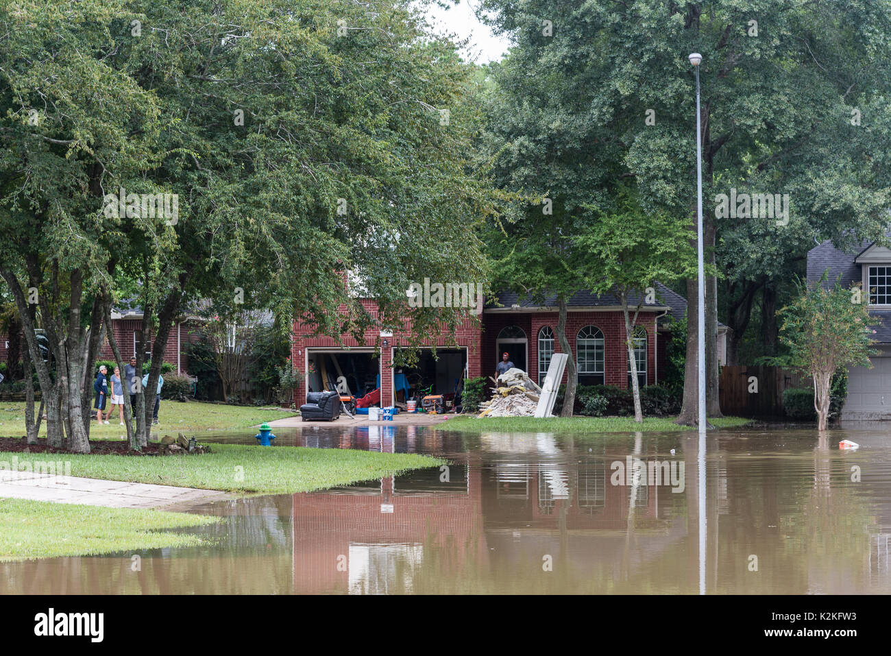 Houston, Texas. 30th Aug, 2017. Family started clean up after historic ...