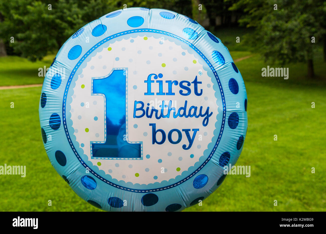 first birthday boy text on ballon Stock Photo - Alamy