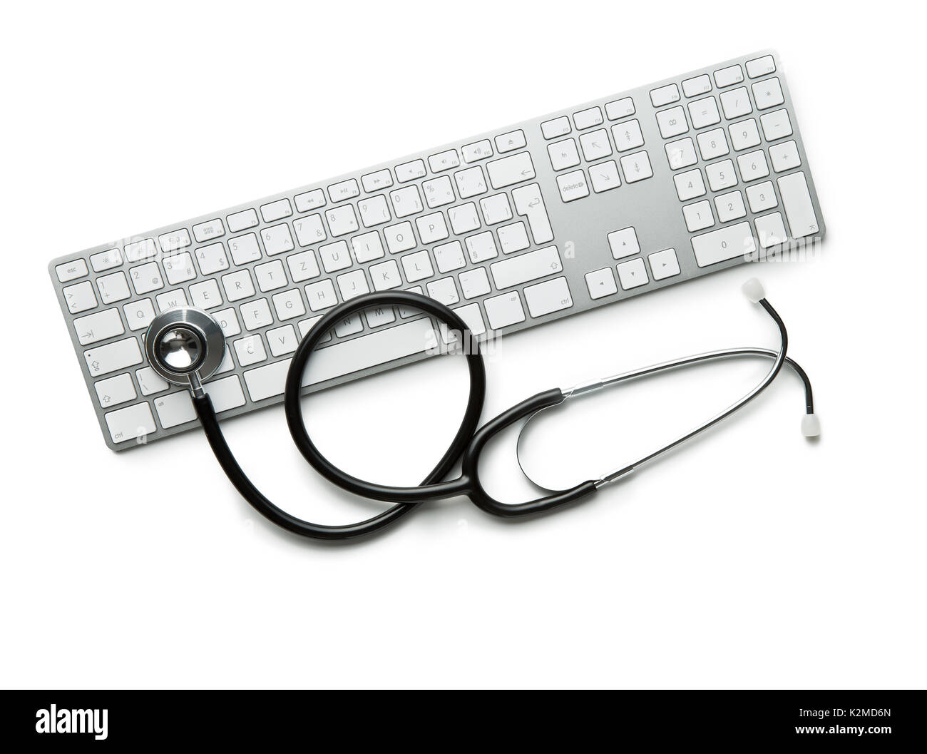 Medical stethoscope on computer keyboard isolated on white background ...