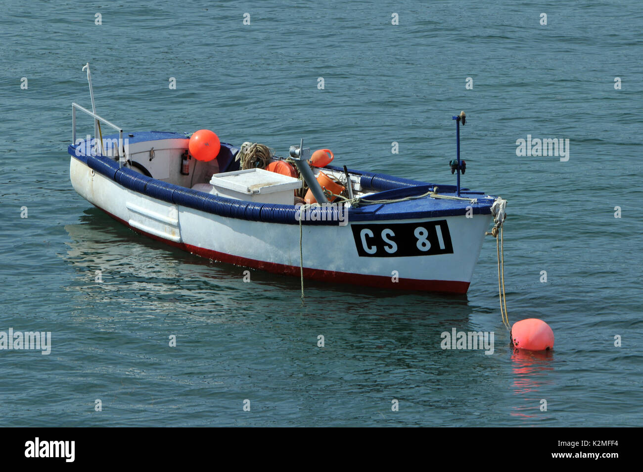 A cowes registered inshore open fishing boat with buoys and floats ...