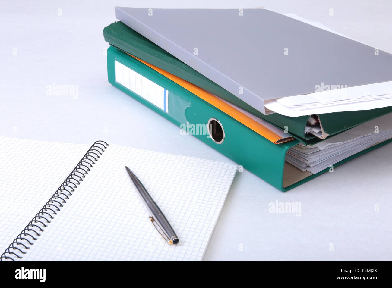 Folder file, note and pen on the desk. blurred background Stock Photo ...