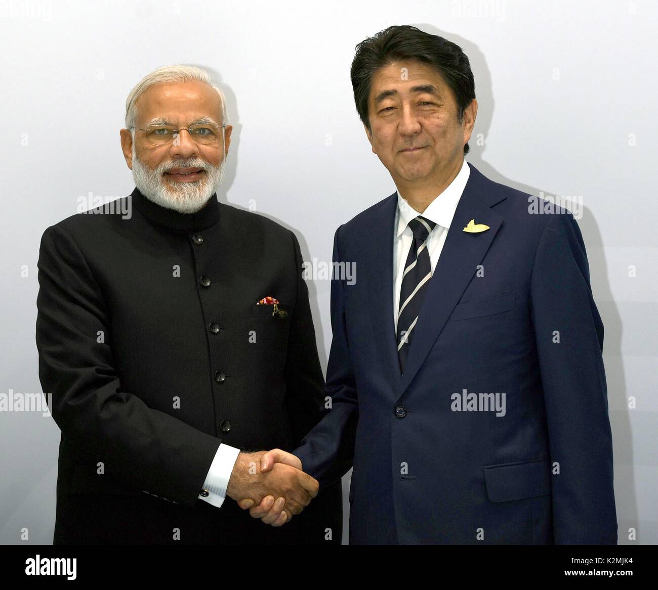 Indian Prime Minister Narendra Modi, left, shakes hands with Japanese ...