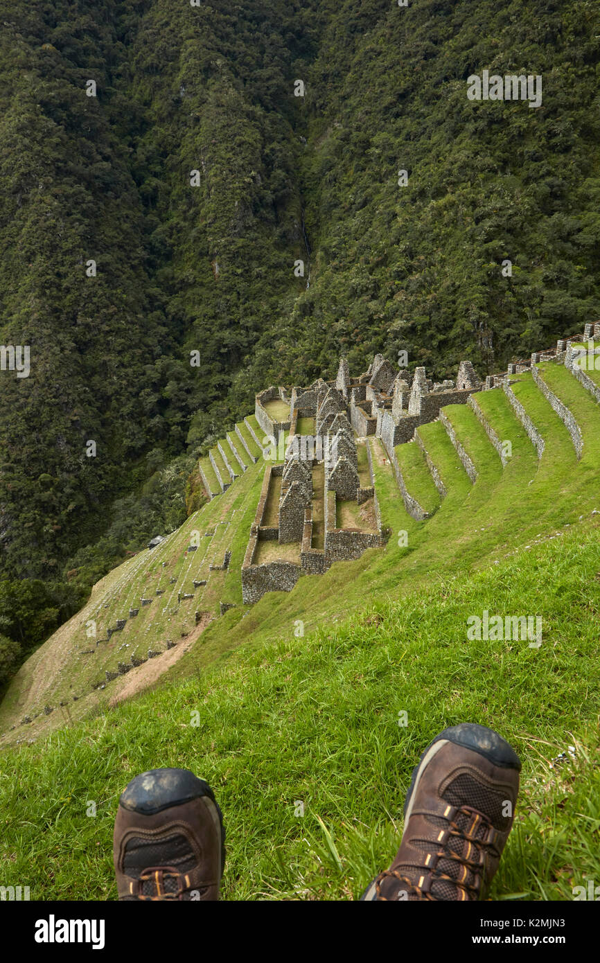 Hiker's boots on the Inca Trail to Machu Picchu, at the historic ruins ...