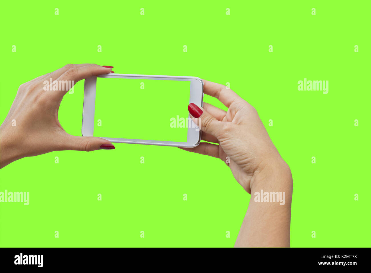 Young girl hand holding mobile smart phone on green screen Stock Photo ...