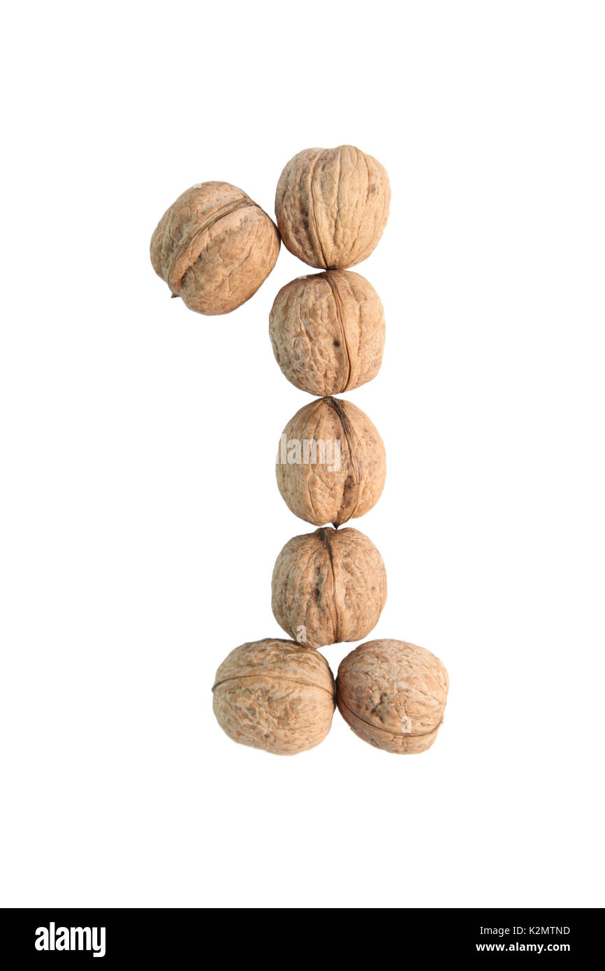The group of walnuts on white background, making number 1. Studio shot ...